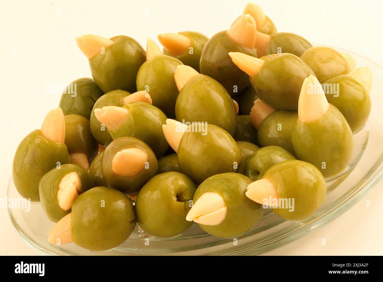 Green olives stuffed with almonds Stock Photo - Alamy