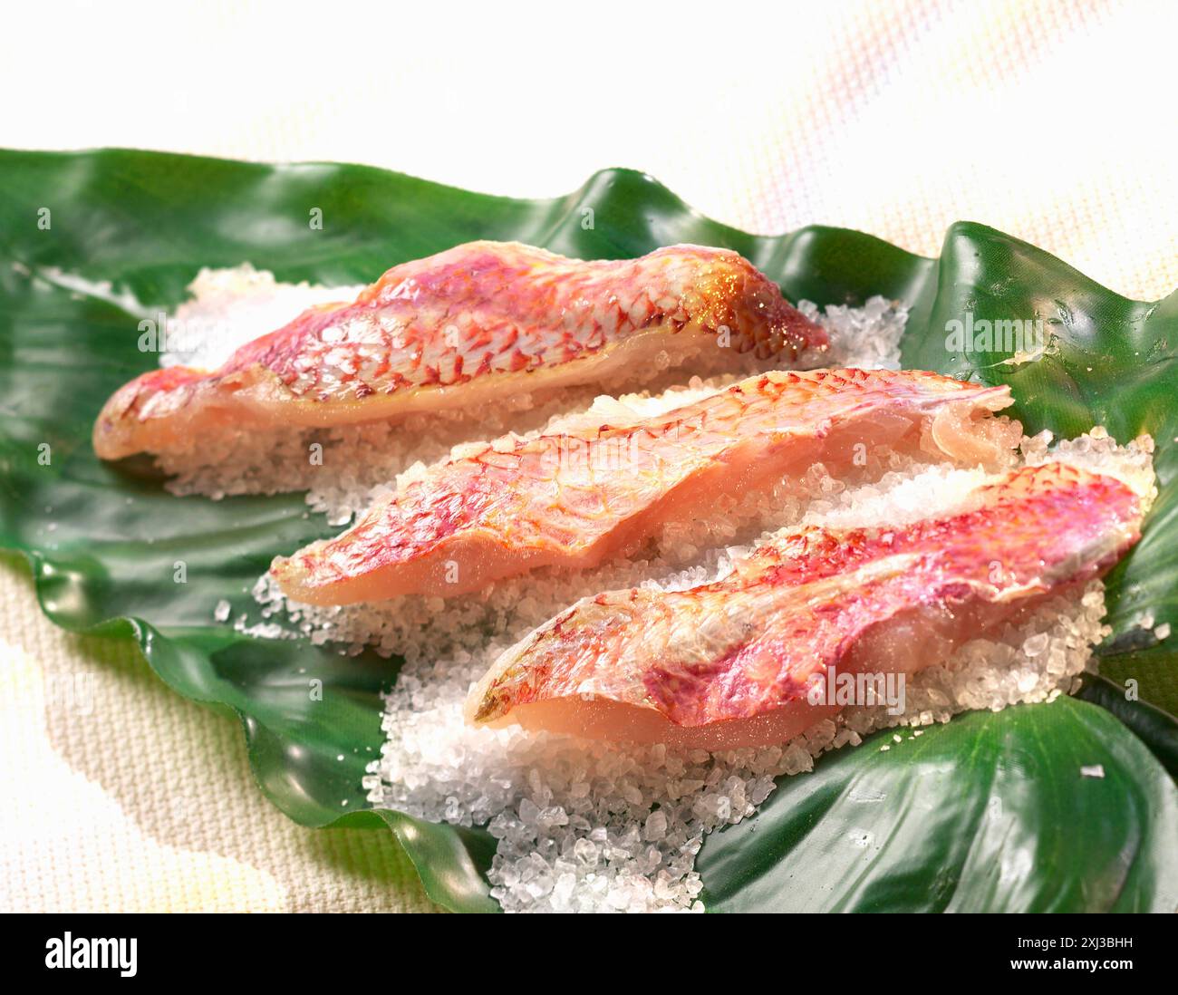 Grilled red mullet fillets on a bed of coarse salt Stock Photo - Alamy
