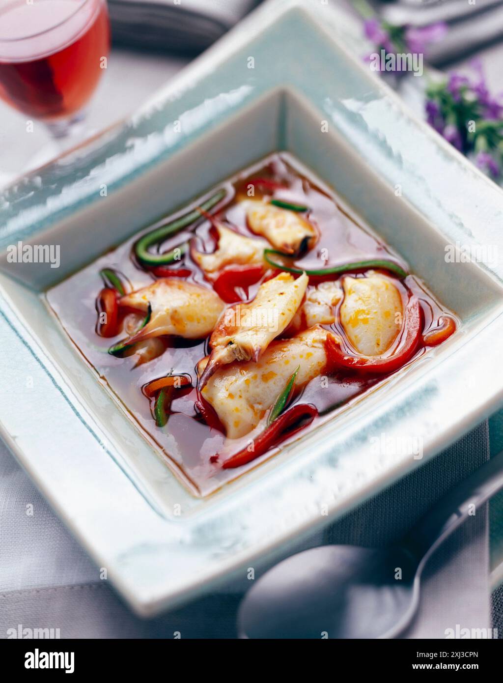 Crab pincers nage with harissa Stock Photo - Alamy