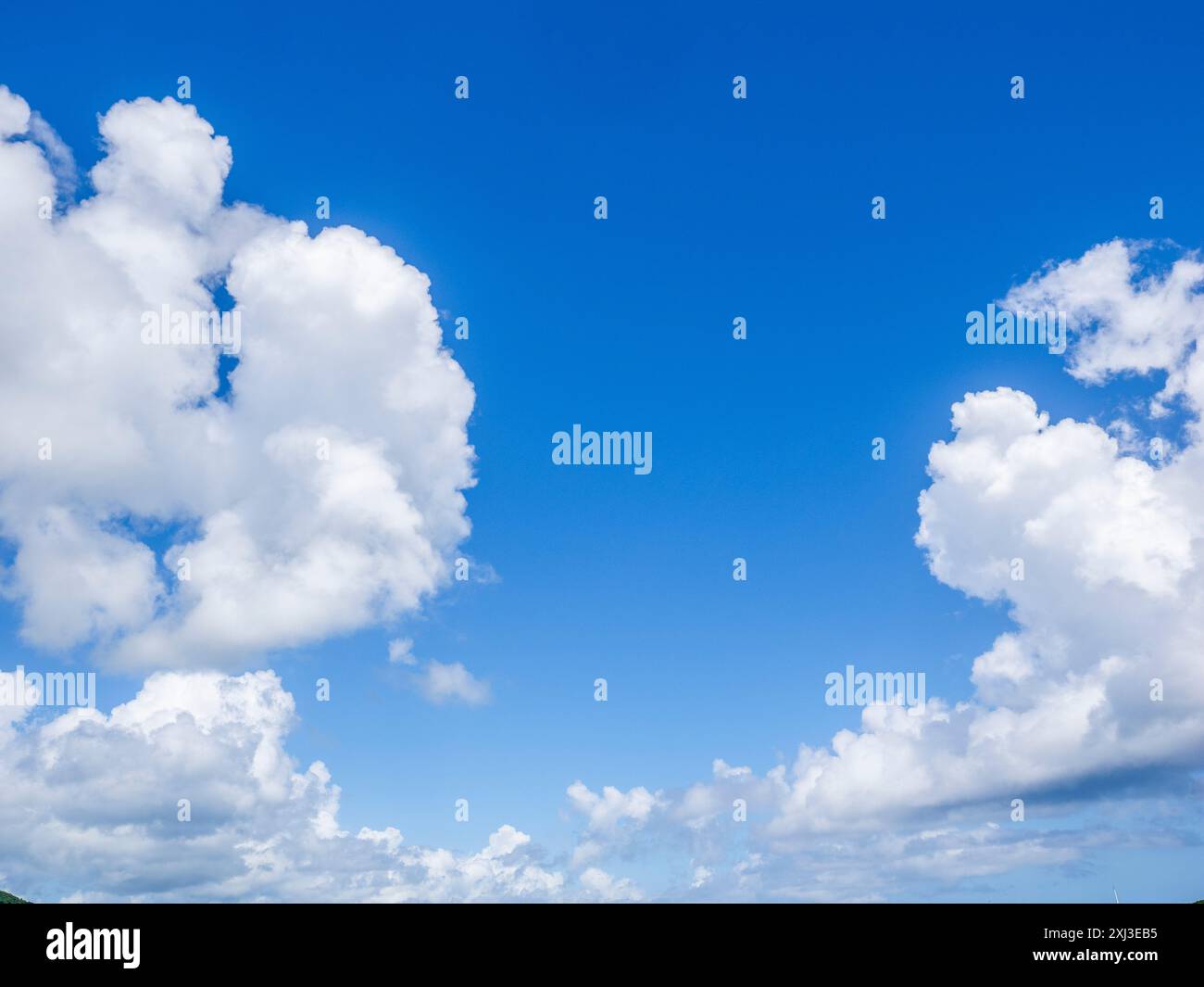 White clouds in a blue sky Stock Photo - Alamy