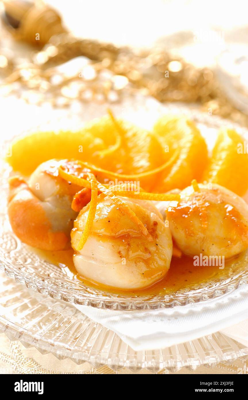 scallops with whisky and orange (topic: scallops Stock Photo - Alamy