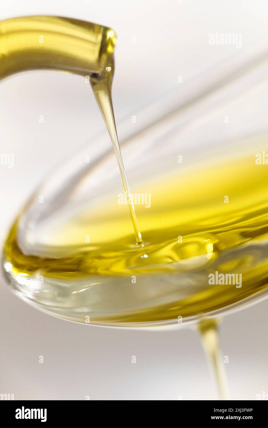 dash of olive oil filling spoon Stock Photo - Alamy