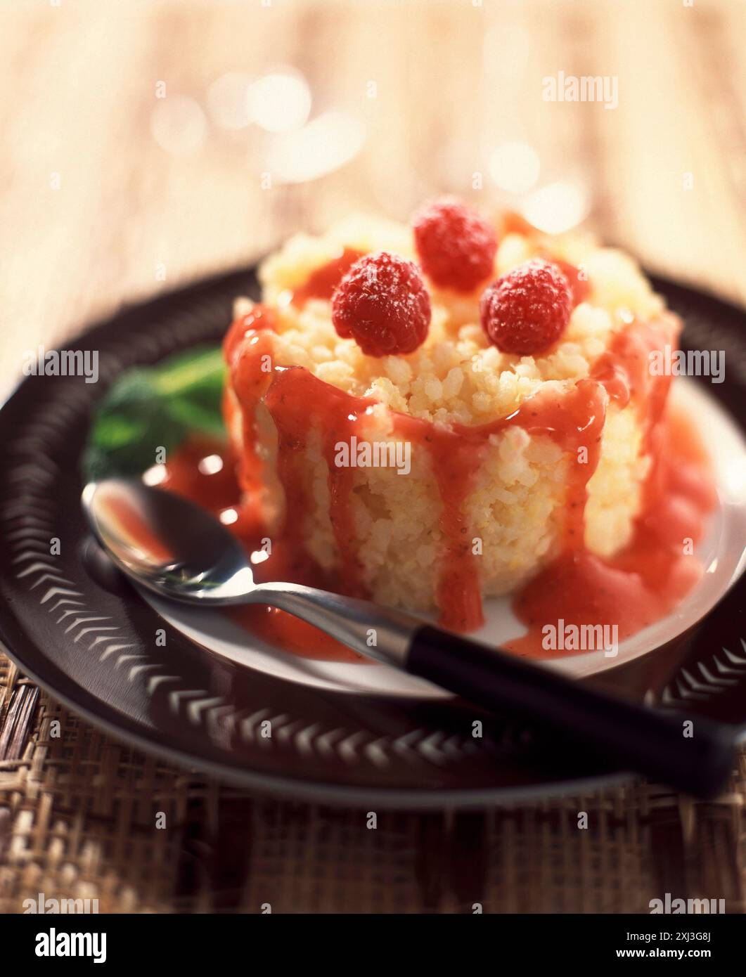Rice timbale with raspberry coulis Stock Photo - Alamy