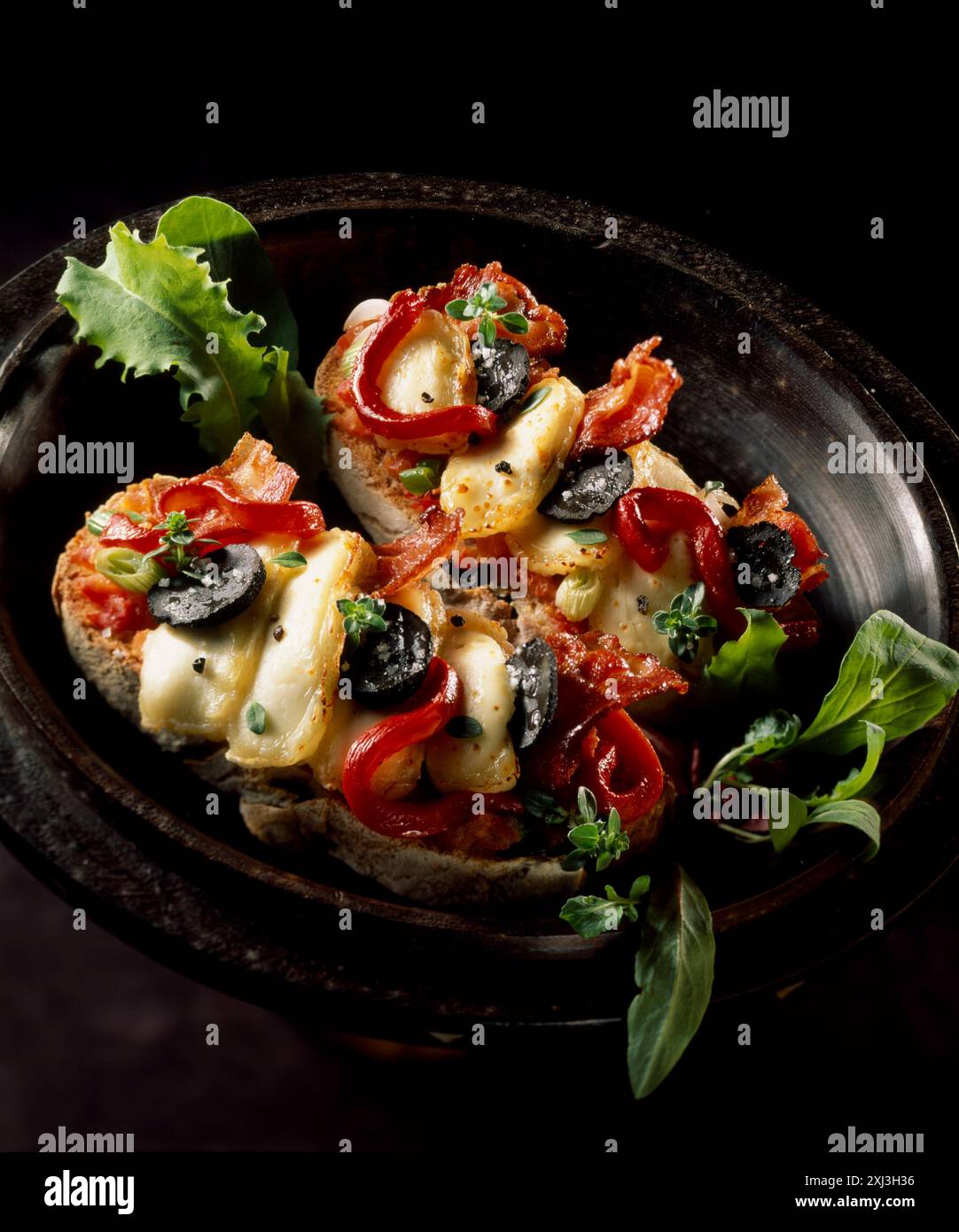 Banon,Picodon and grilled bacon open sandwiches,rocket lettuce Stock ...