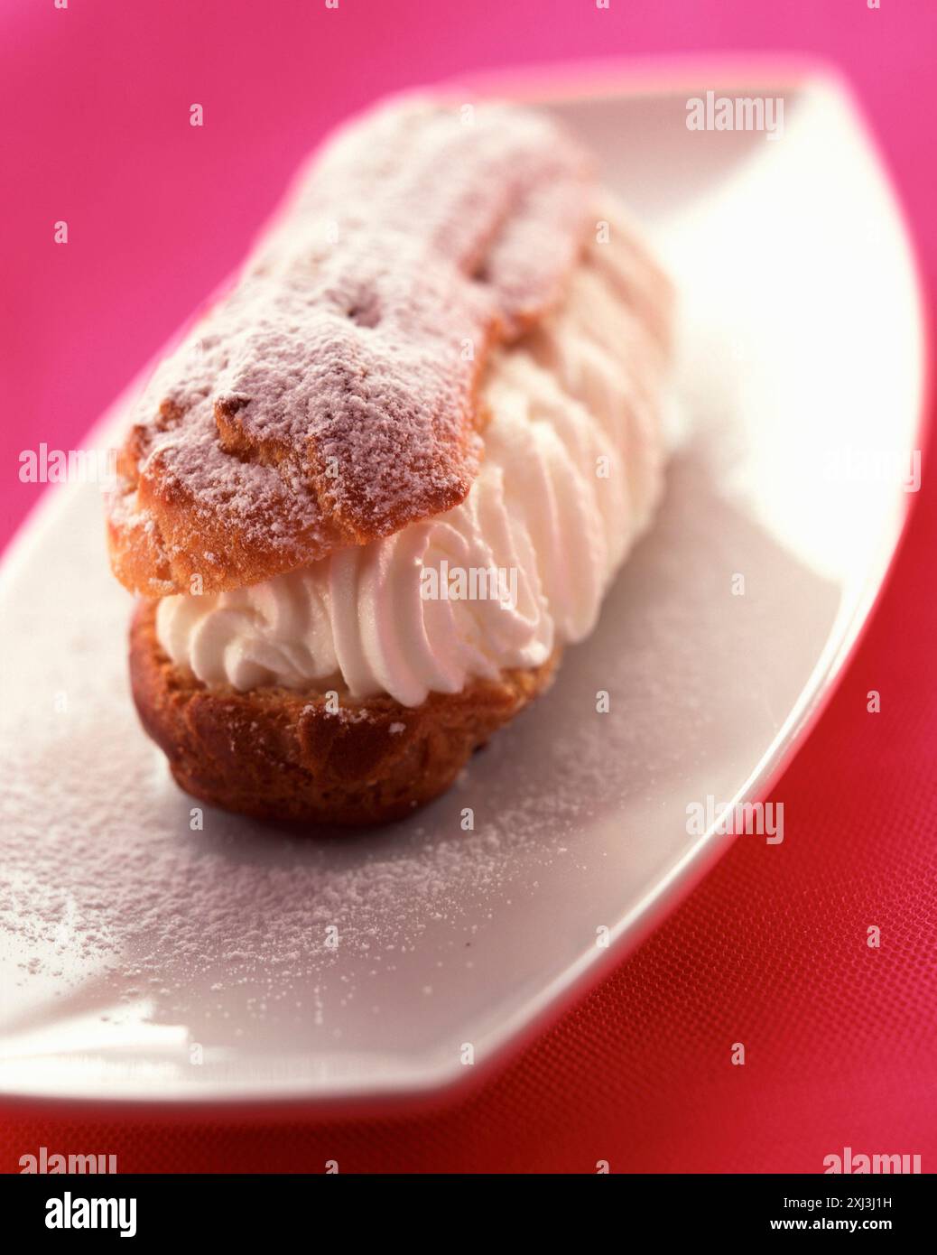 Whipped cream eclair Stock Photo - Alamy