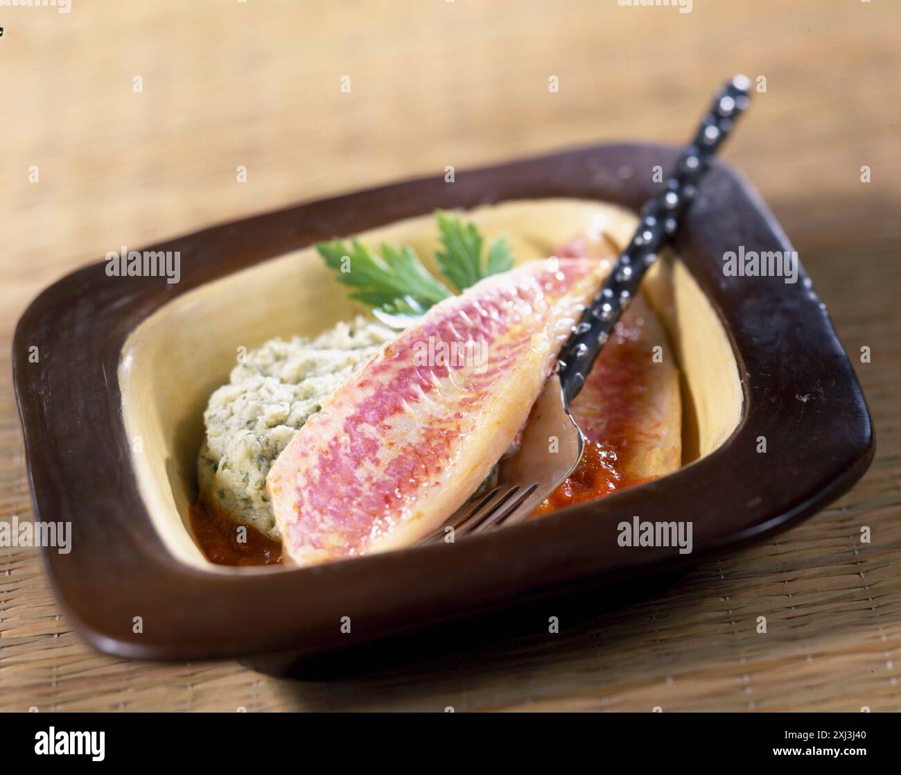 Red mullet fillets and mashed potatoes with herbs Stock Photo - Alamy