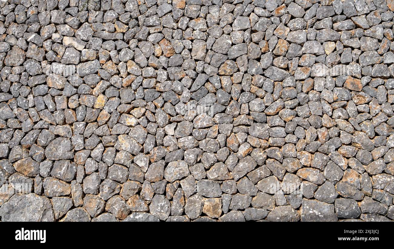 Flat lay photograph of a colorful stone wall. Stone background texture ...