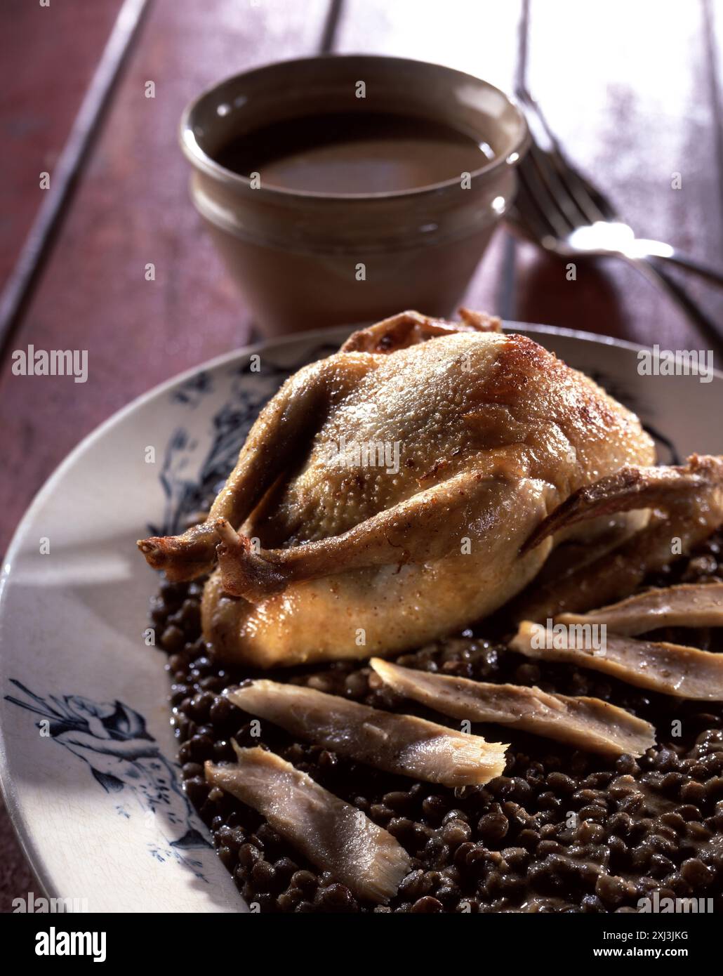 Partridge roasted with amber beer,tuna and lentils Stock Photo - Alamy