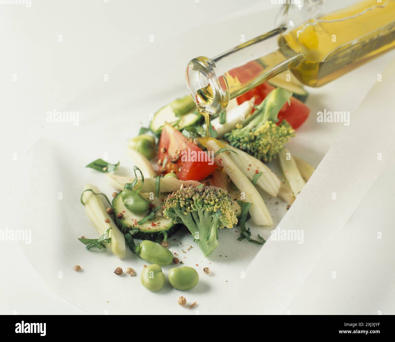 Adding the olive oil Stock Photo - Alamy