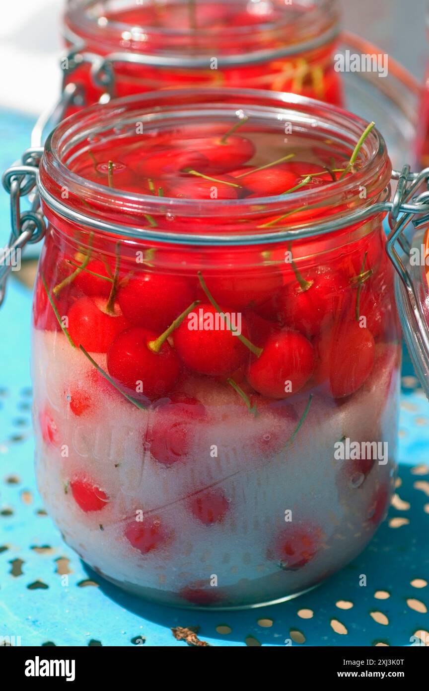 Jar of cherries in syrup Stock Photo - Alamy