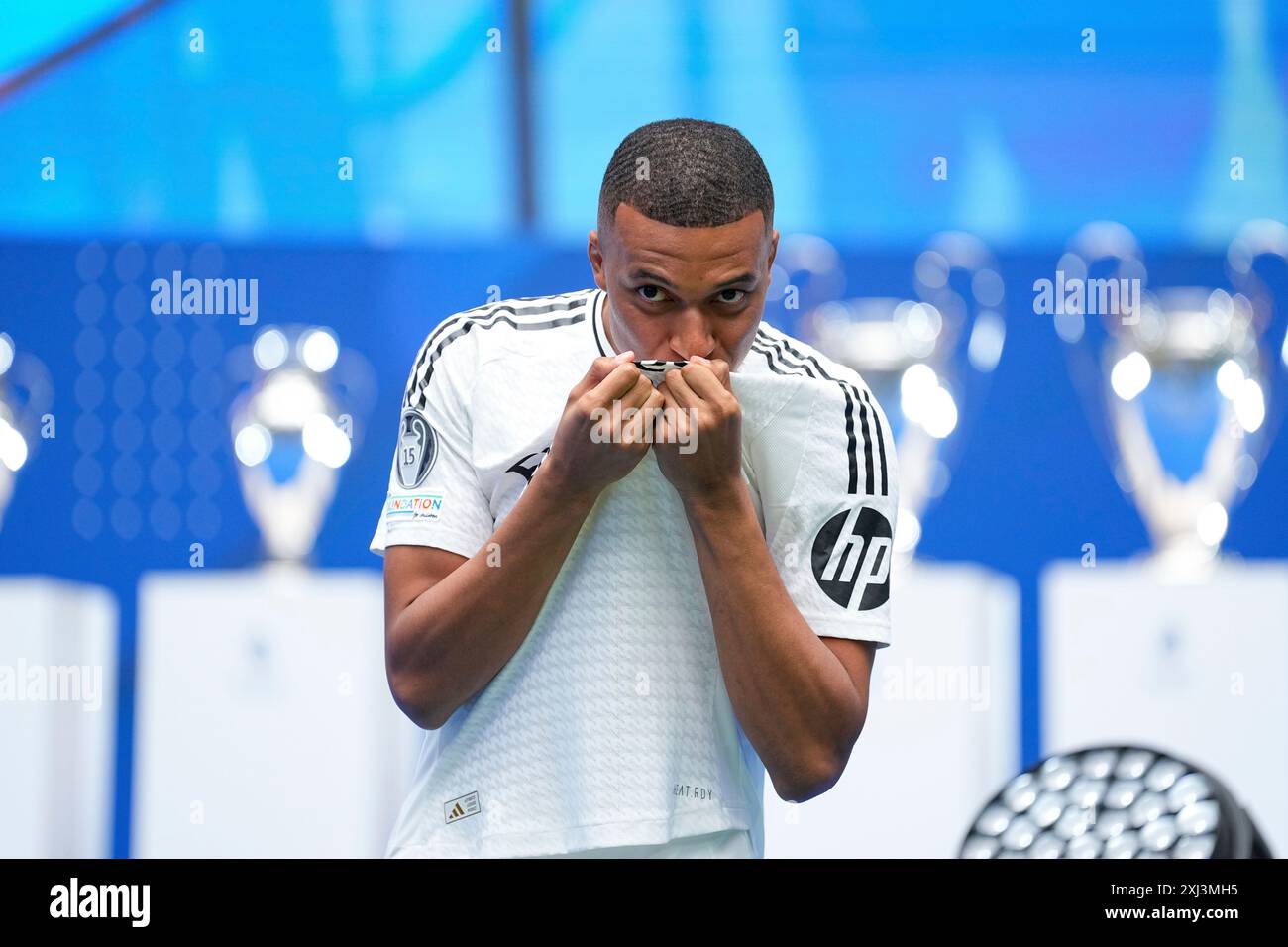 Kylian Mbappe kiss the badge of Real Madrid during his presentation as ...