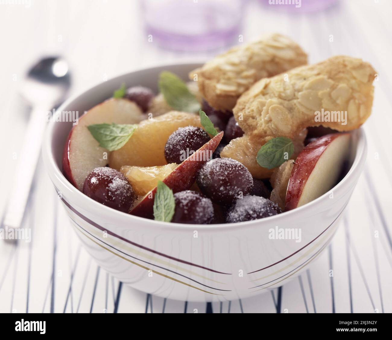 Grapefruit,grape and apple fruit salad with almond tuile biscuits Stock ...