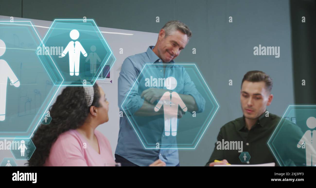 Image of profile icons floating against diverse colleagues discussing ...