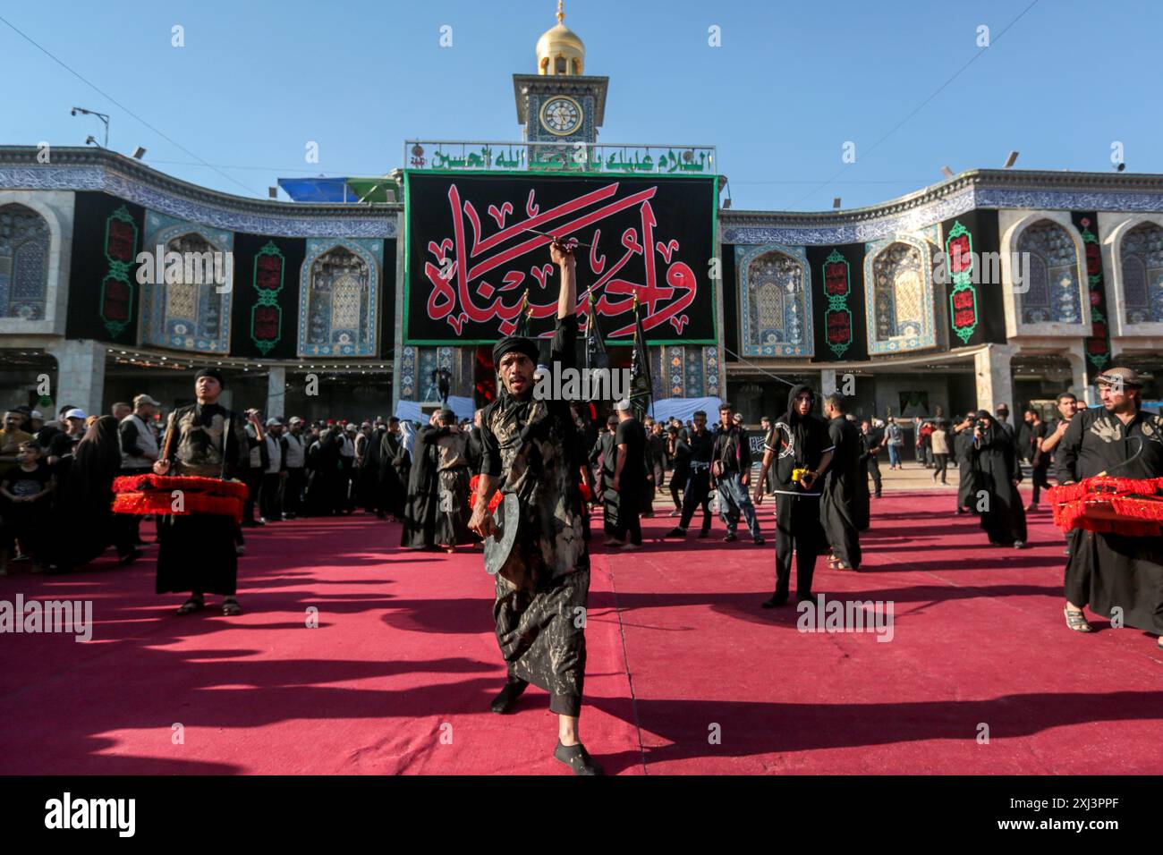 Iraqi Shiites mark the month of Muharram in Karbala, Iraq, on Tuesday ...