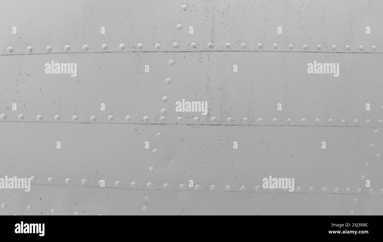 Riveted metal texture background in gray color Stock Photo - Alamy