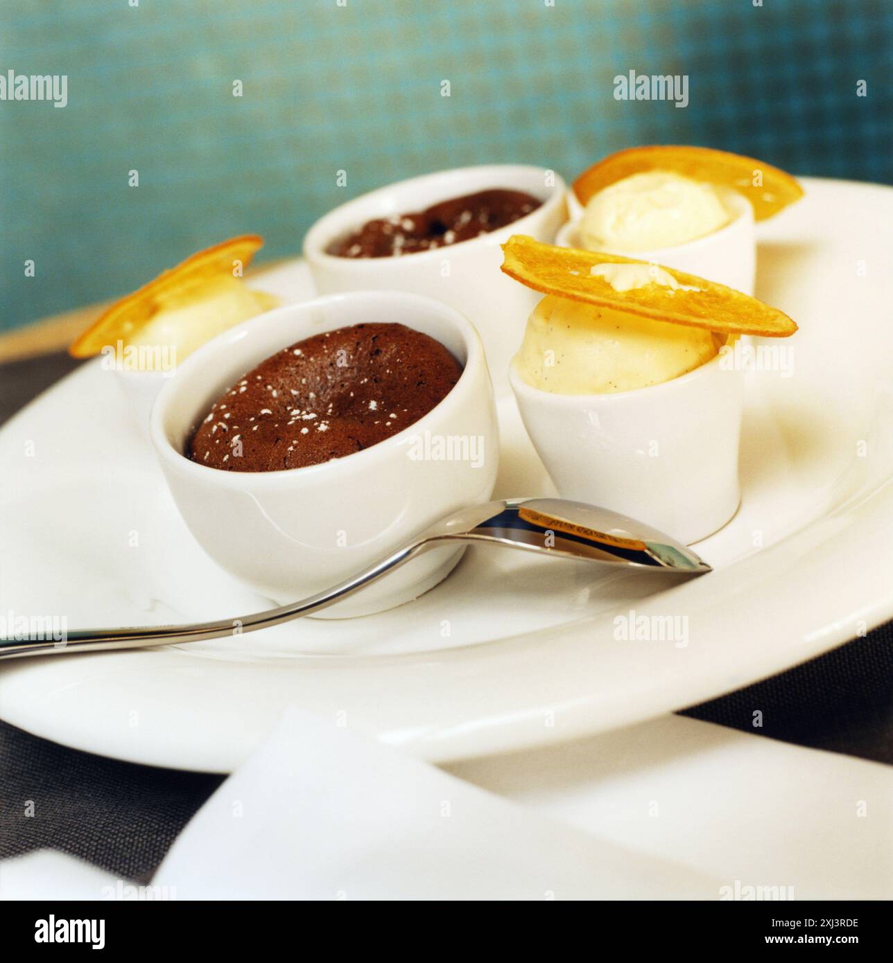 Runny chocolate individual puddings with vanilla ice cream Stock Photo ...