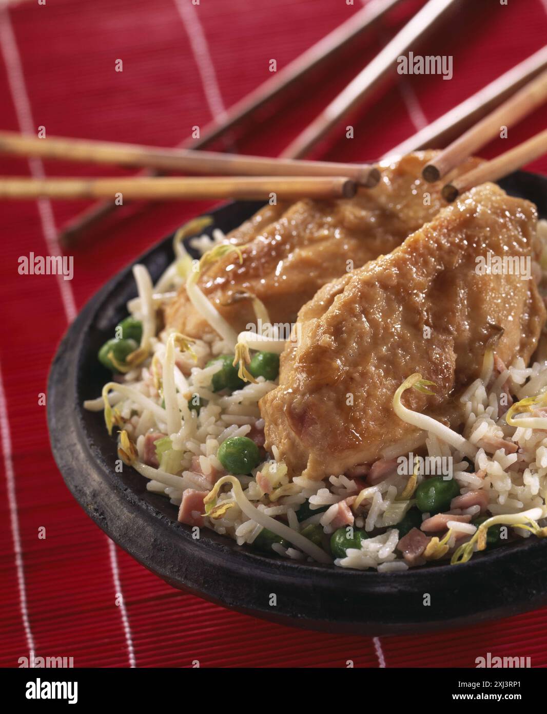 Pan-fried chicken with rice Stock Photo - Alamy