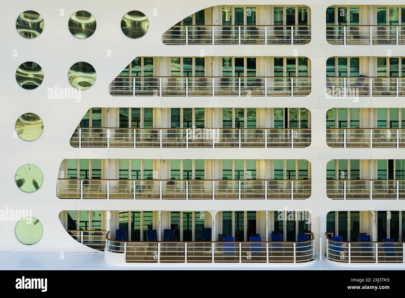 Large cruise ship side view fragment with round portholes rows and ...