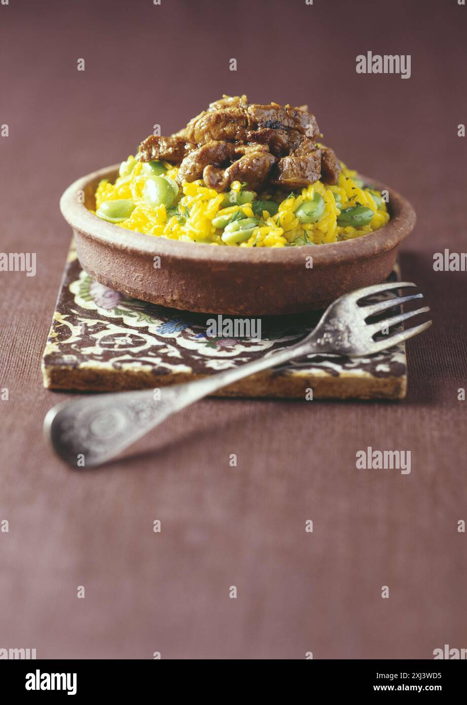 Sauteed beef with saffron rice Stock Photo - Alamy