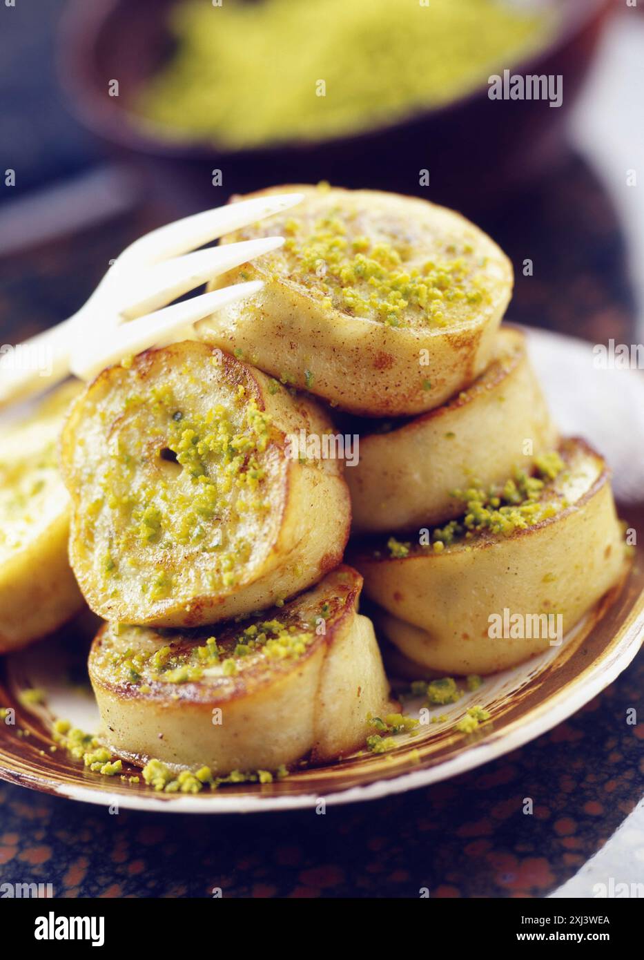 crunchy pistachio crepe rolls Stock Photo - Alamy