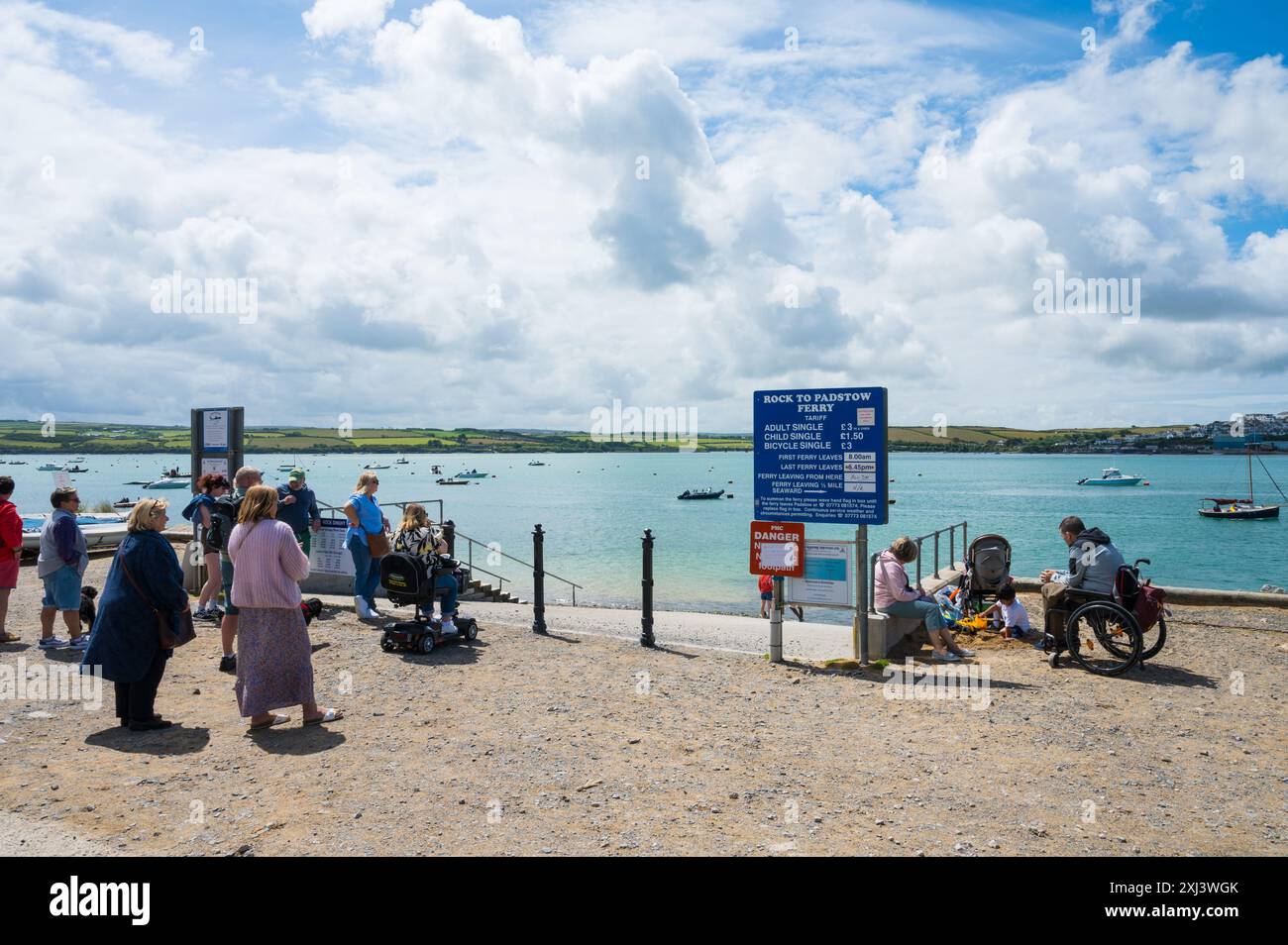 People waiting at the ferry landing in the village of Rock for the ...