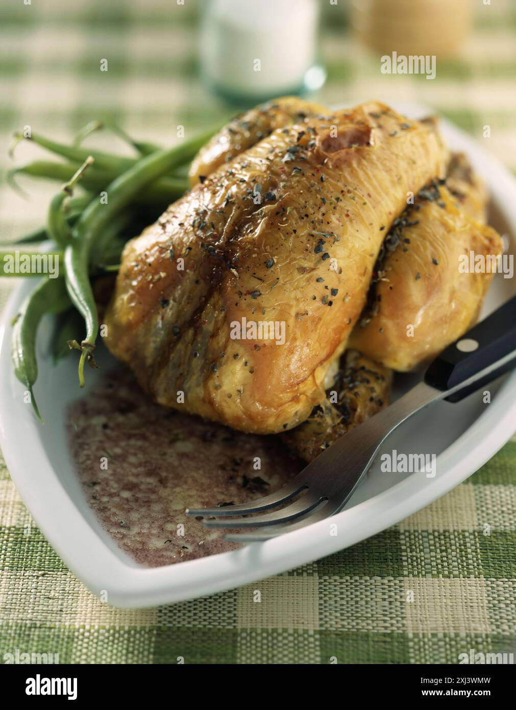 roast young cockerel with oregano Stock Photo - Alamy