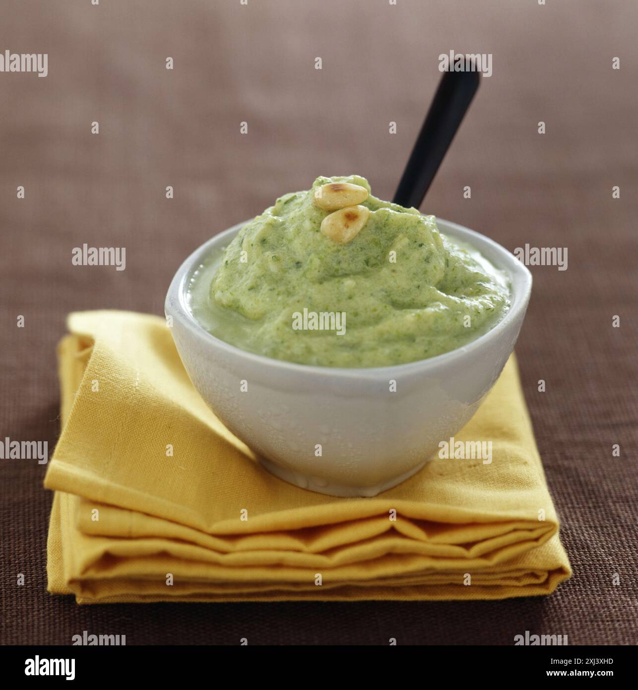 Zucchini and pesto mousse with pine nuts Stock Photo - Alamy