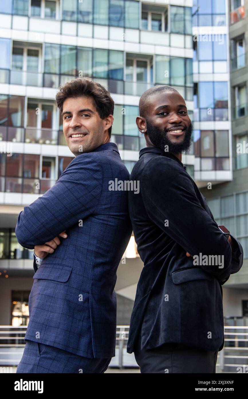 vertical Two confident businessmen, one African and the other Hispanic ...