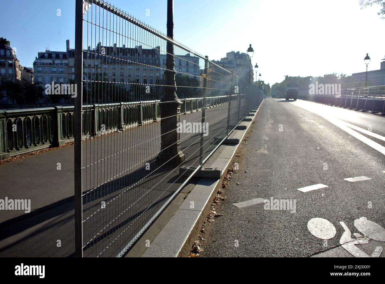 Paris, France. 16th July, 2024. Fences are is installed in nearby ...
