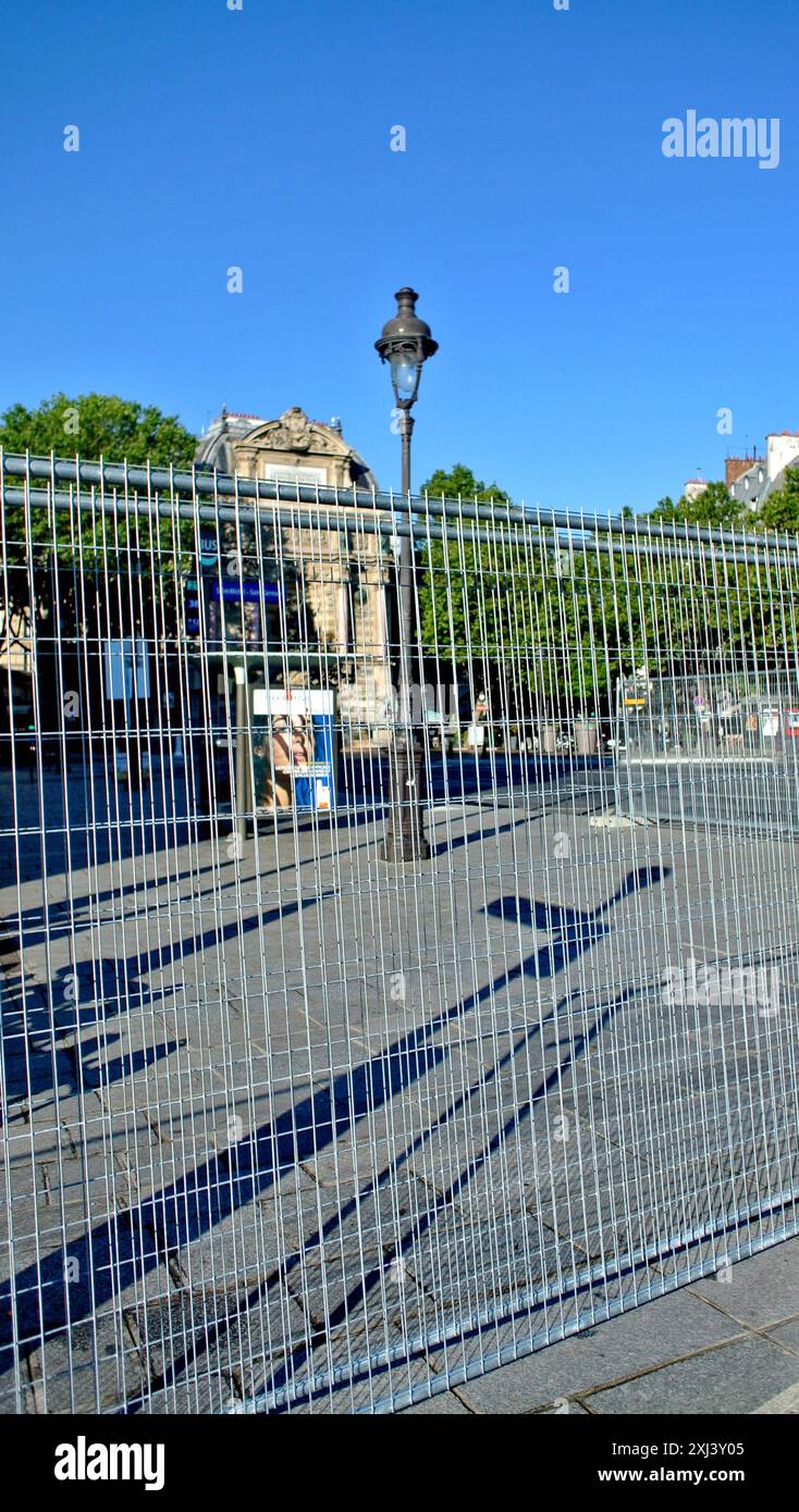 Paris, France. 16th July, 2024. Fences are is installed in nearby ...