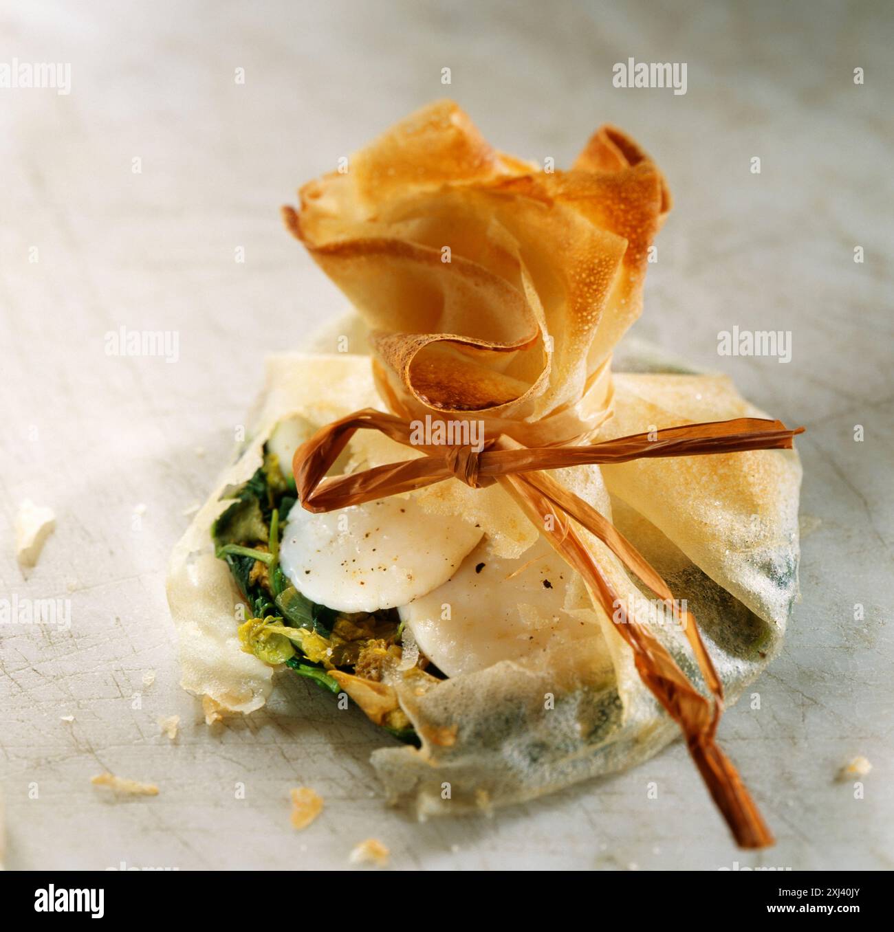 Scallop filo pastry purse Stock Photo - Alamy