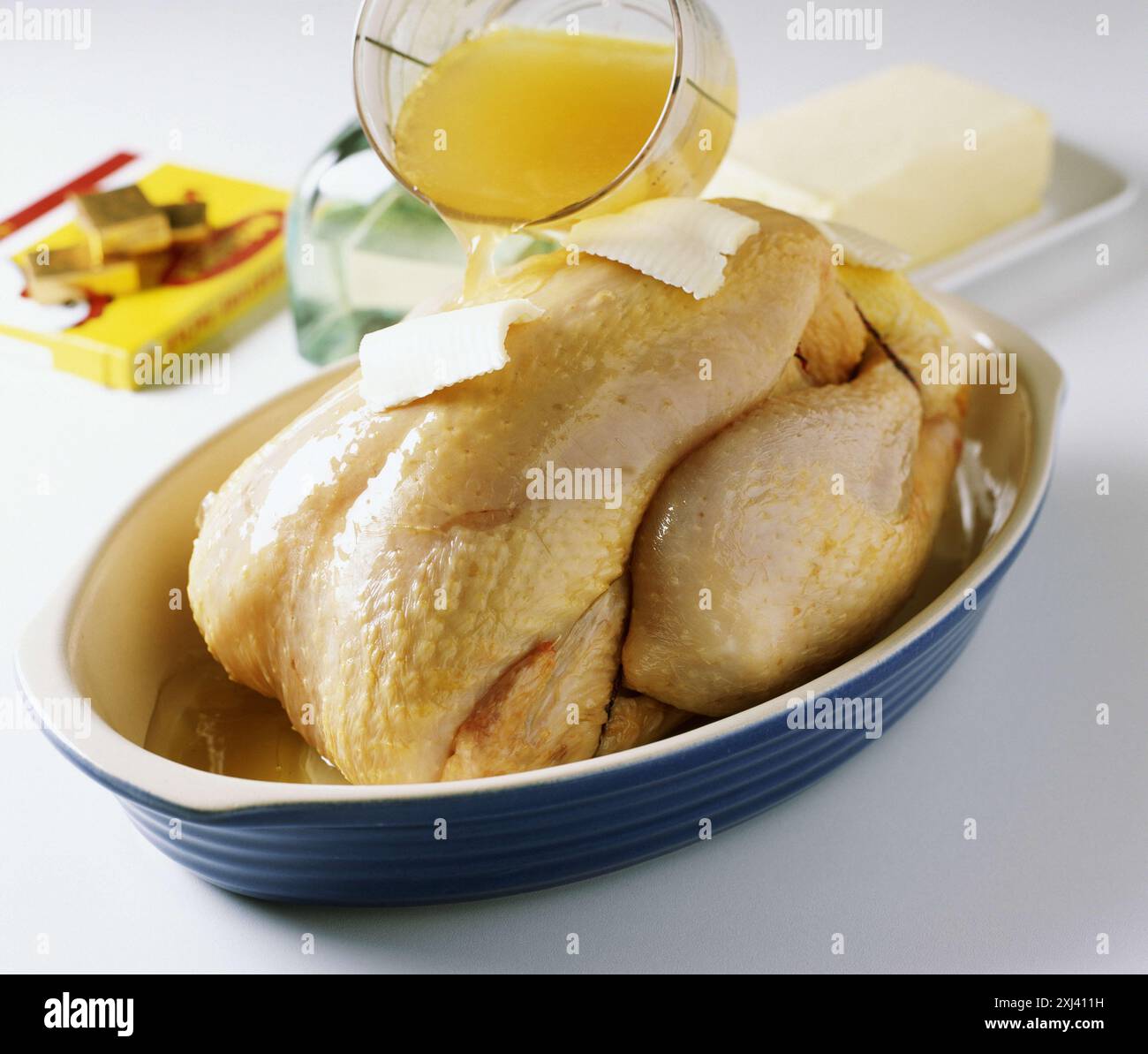 Covering the chicken with butter and oil ( topic : roast chicken with ...