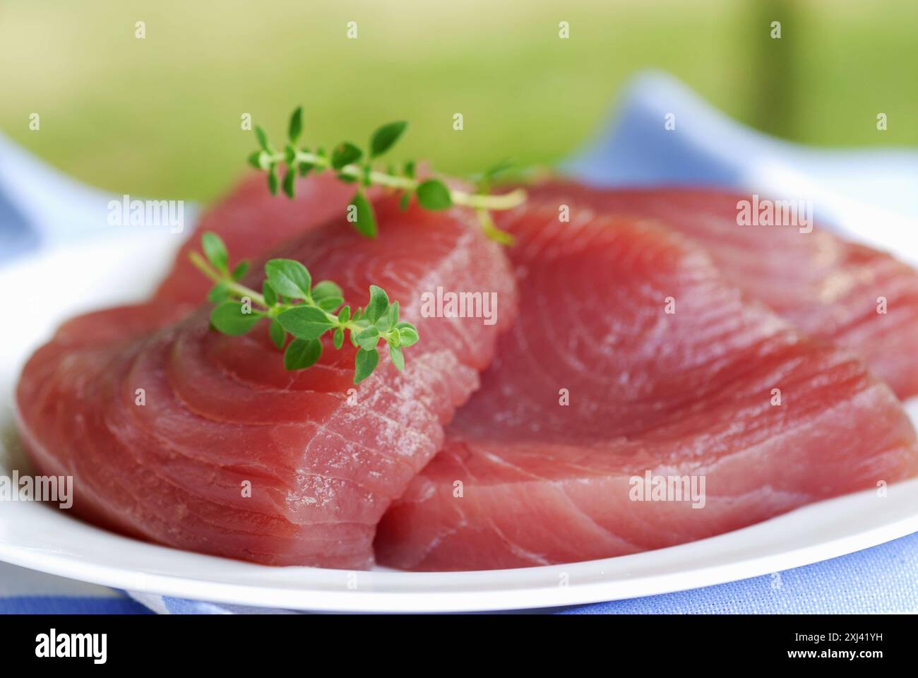 Thick piece of raw tuna Stock Photo - Alamy