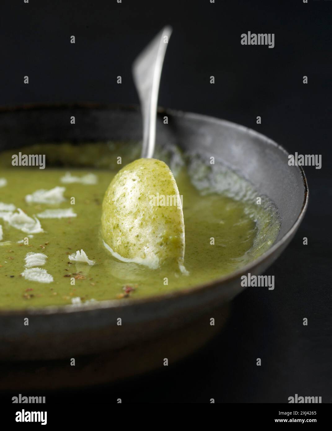 Rocket lettuce soup with parmesan flakes Stock Photo - Alamy