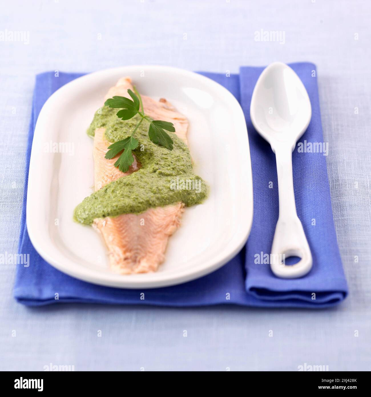 Trou with parsley sauce Stock Photo - Alamy