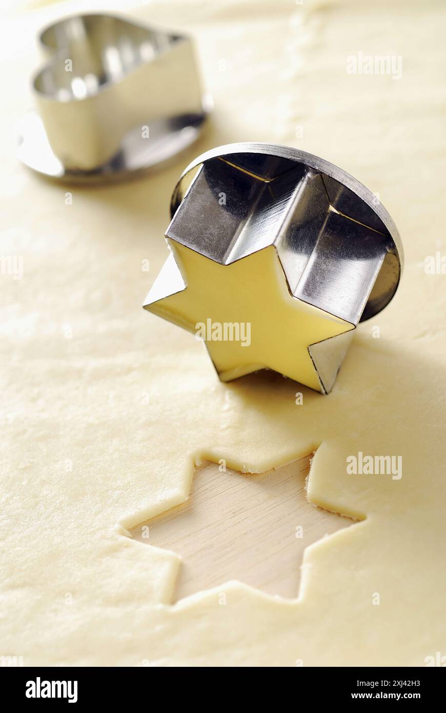 Star-shaped biscuit cutter with pastry Stock Photo - Alamy