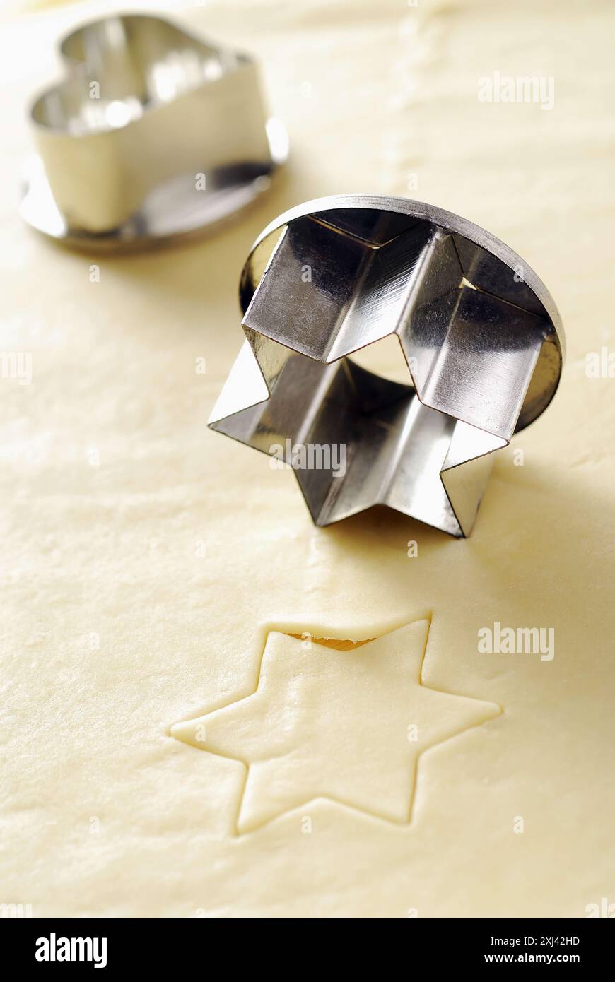 Star-shaped biscuit cutter with pastry Stock Photo - Alamy