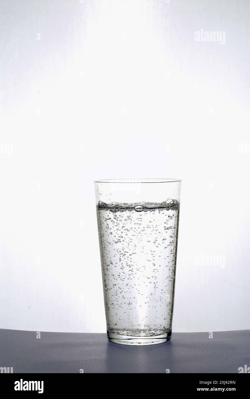 Glass of fizzy water Stock Photo - Alamy