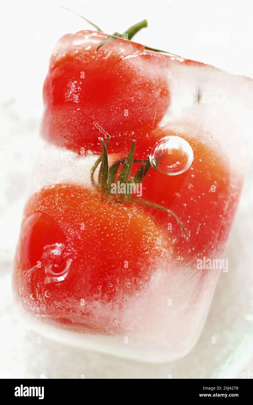 Cherry tomato ice cubes Stock Photo - Alamy
