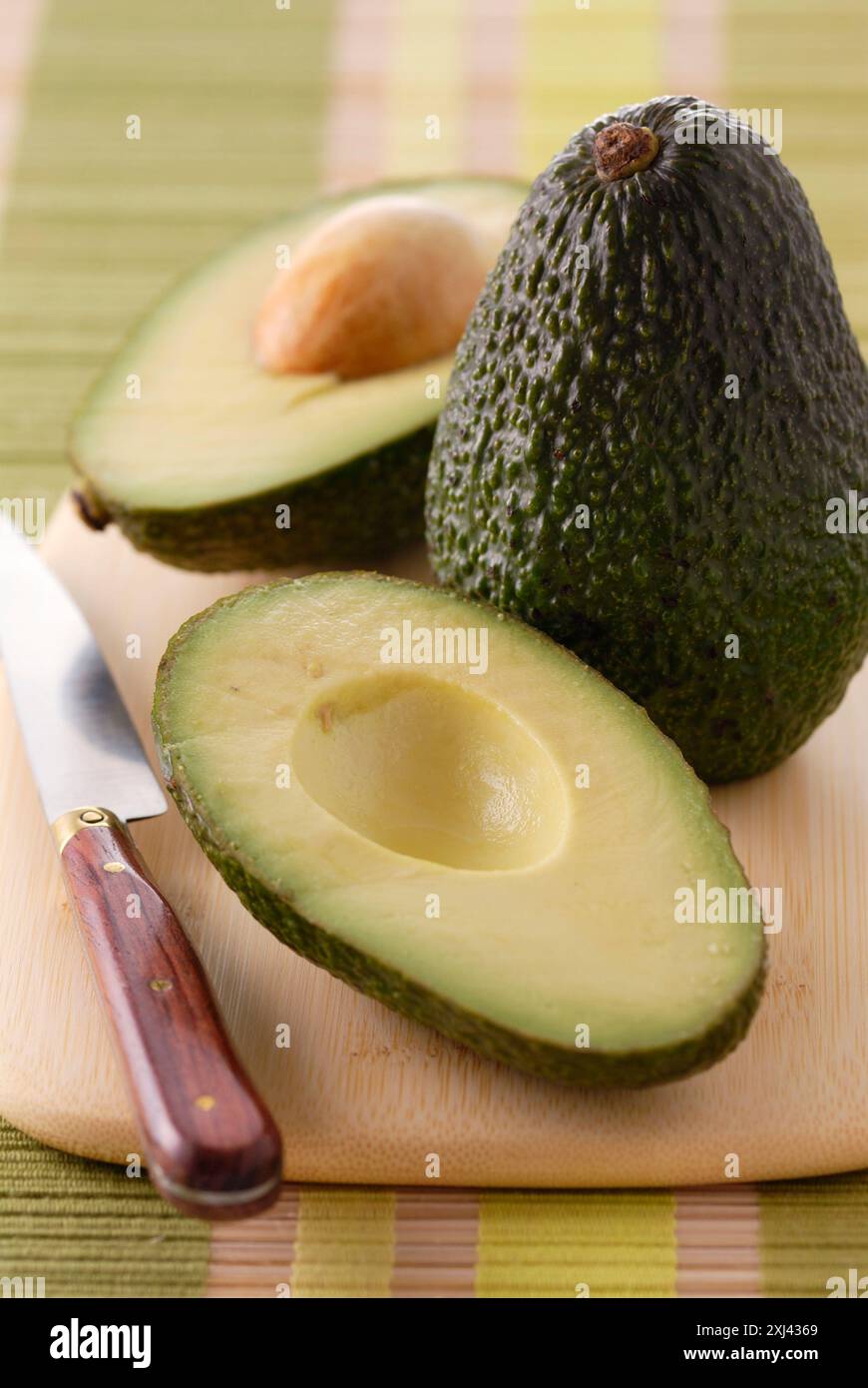 avocados,whole and cut in half Stock Photo - Alamy
