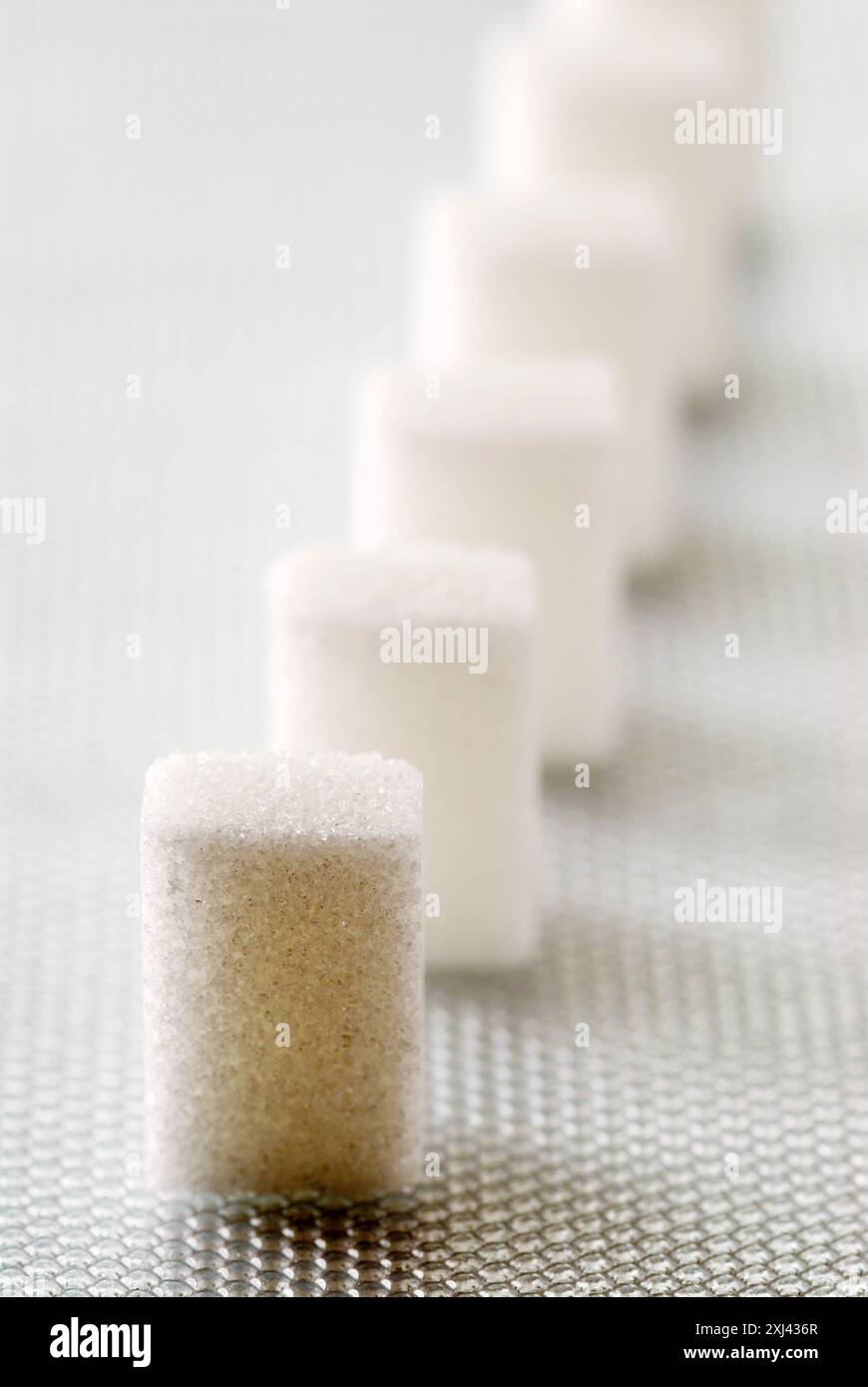 Line of sugar lumps Stock Photo - Alamy