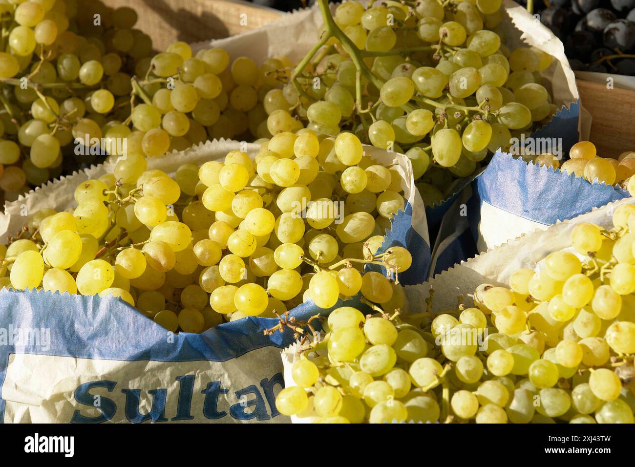 Paper bags of white grapes Stock Photo - Alamy