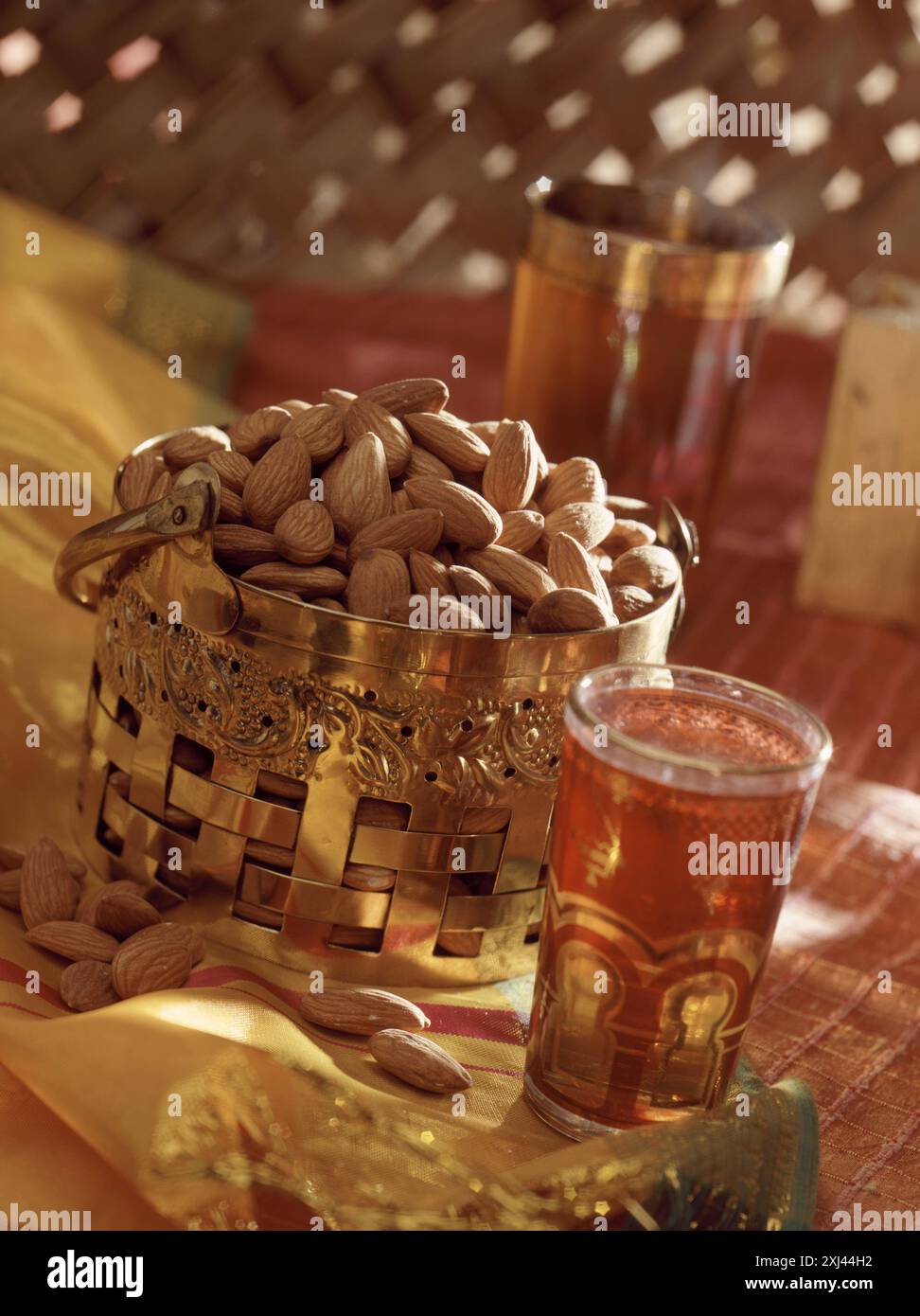 Almonds and a glass of tea Stock Photo - Alamy