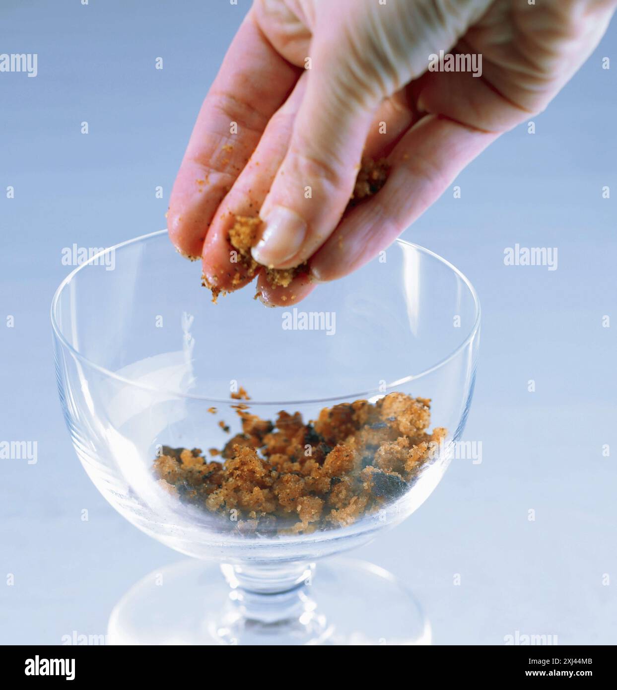 Crumbling the gingerbread Stock Photo - Alamy