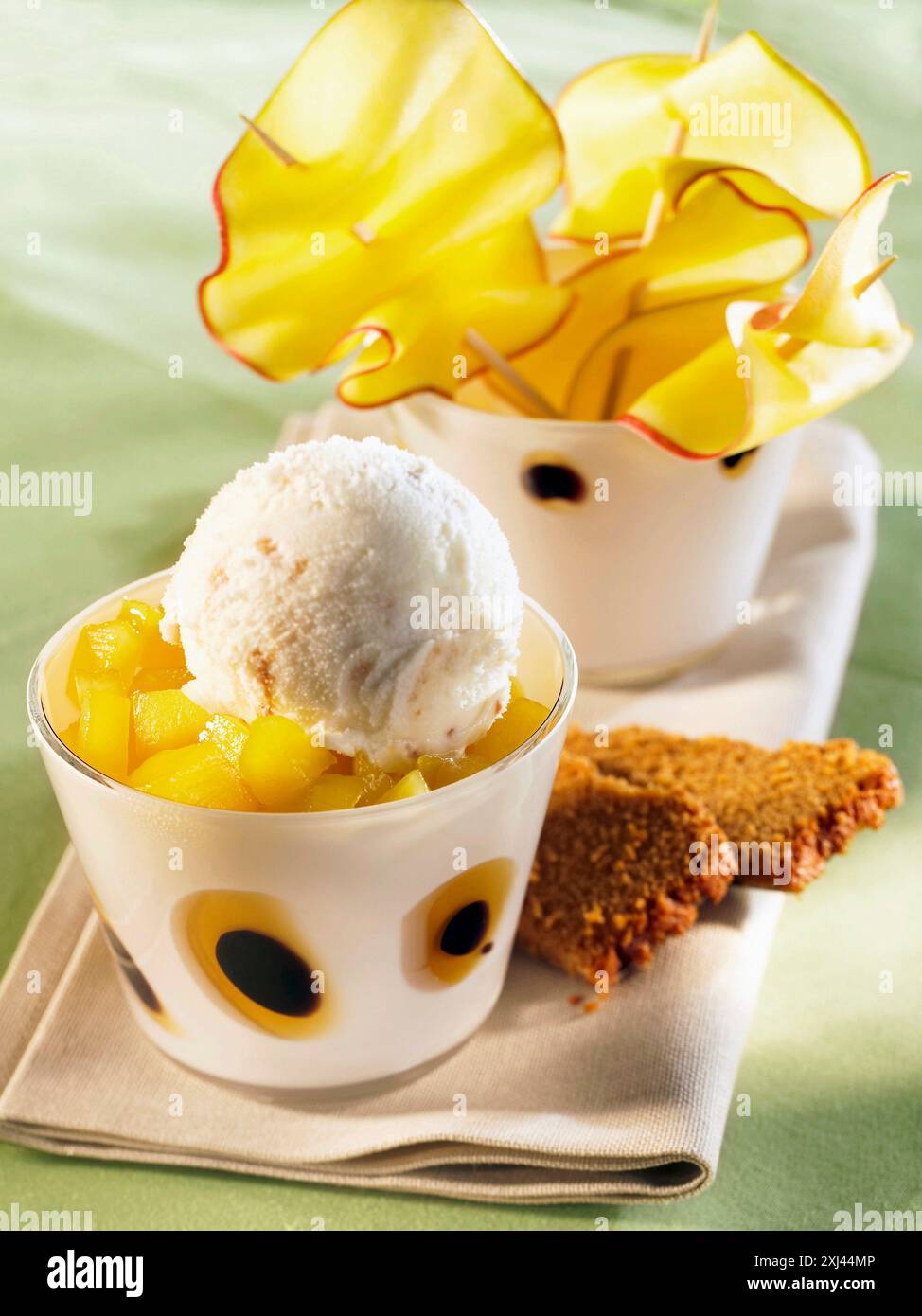 Stewed mangoes with almond ice cream Stock Photo - Alamy