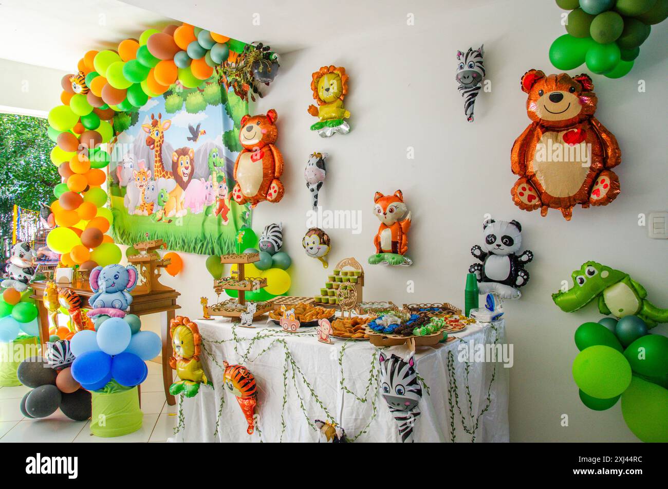 Childrens birthday party zoo themed decoration with colorful baloons ...