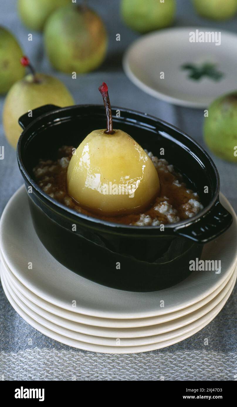 Rice pudding with poached pear Stock Photo - Alamy