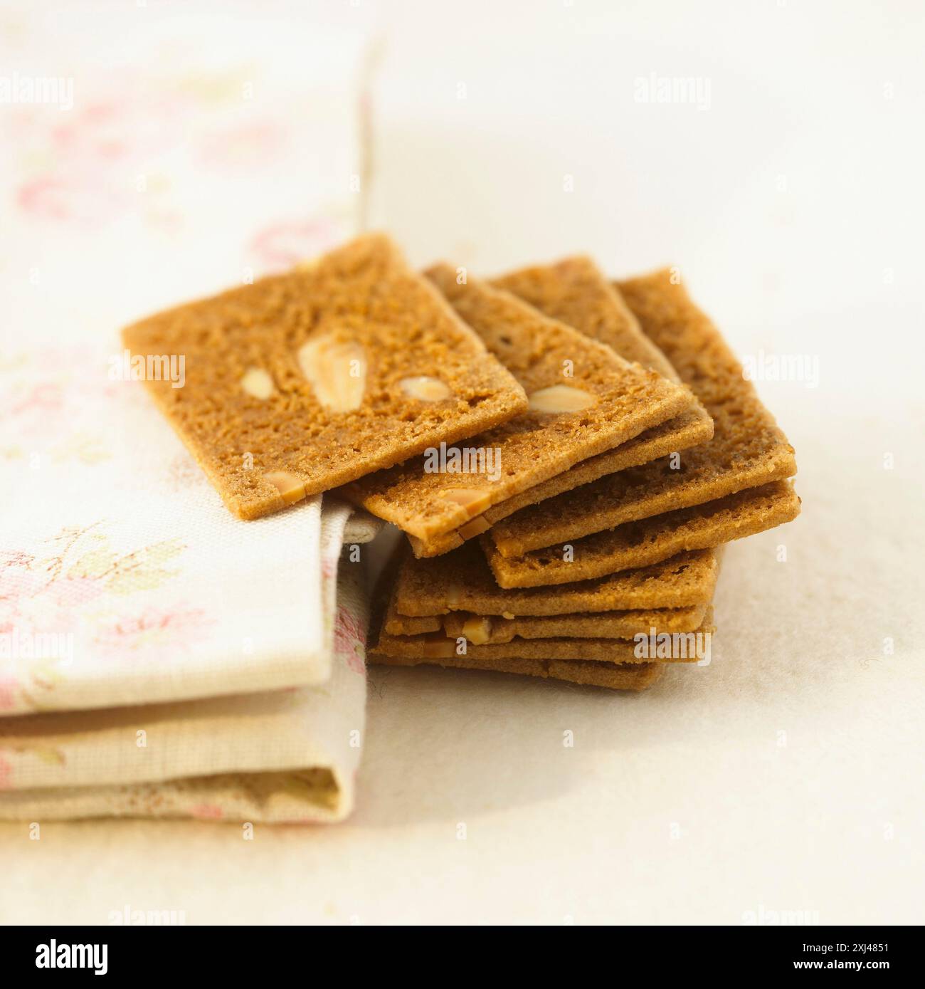 Pile of square almond biscuits Stock Photo - Alamy