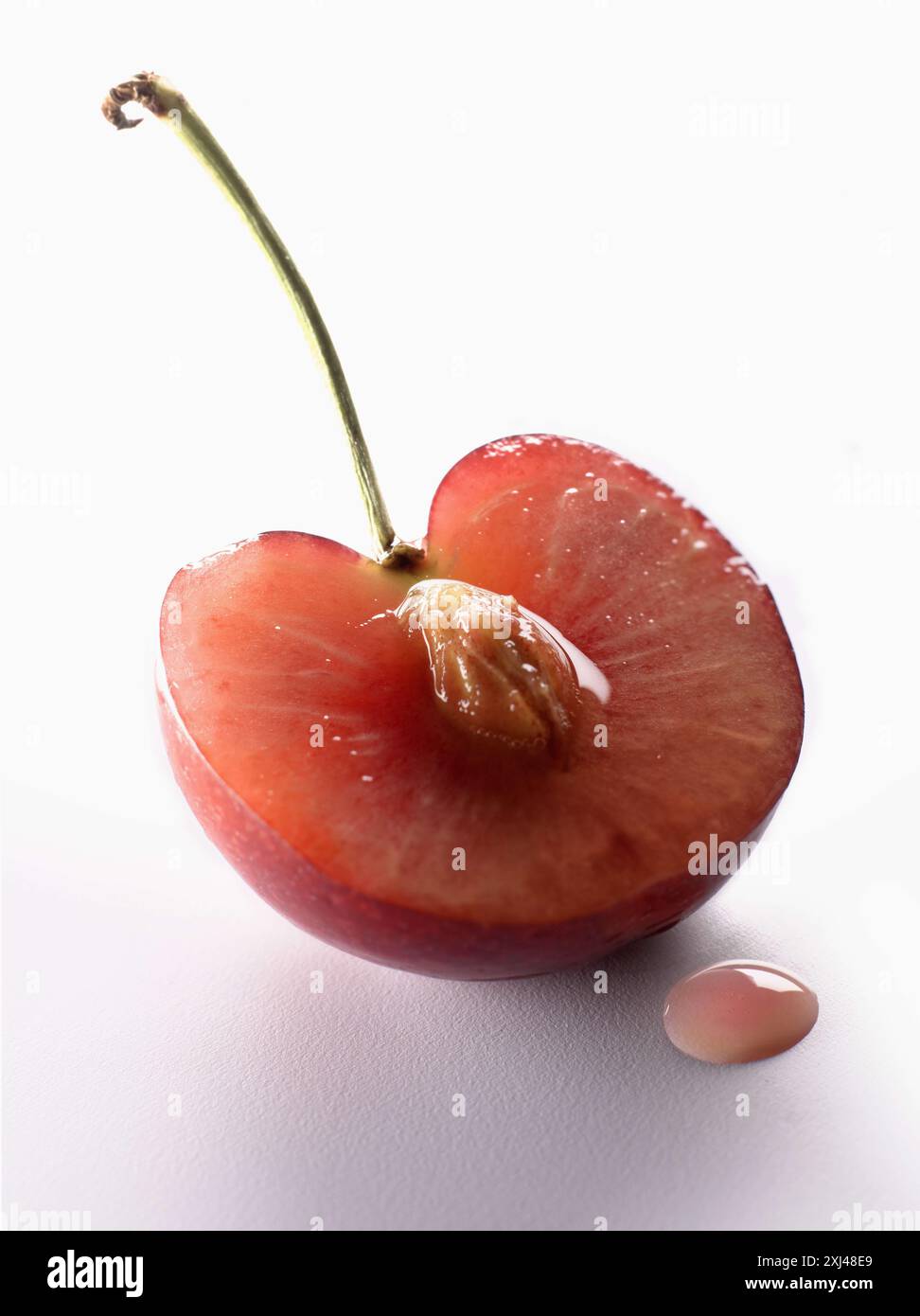 Cut in half cherry hi-res stock photography and images - Alamy