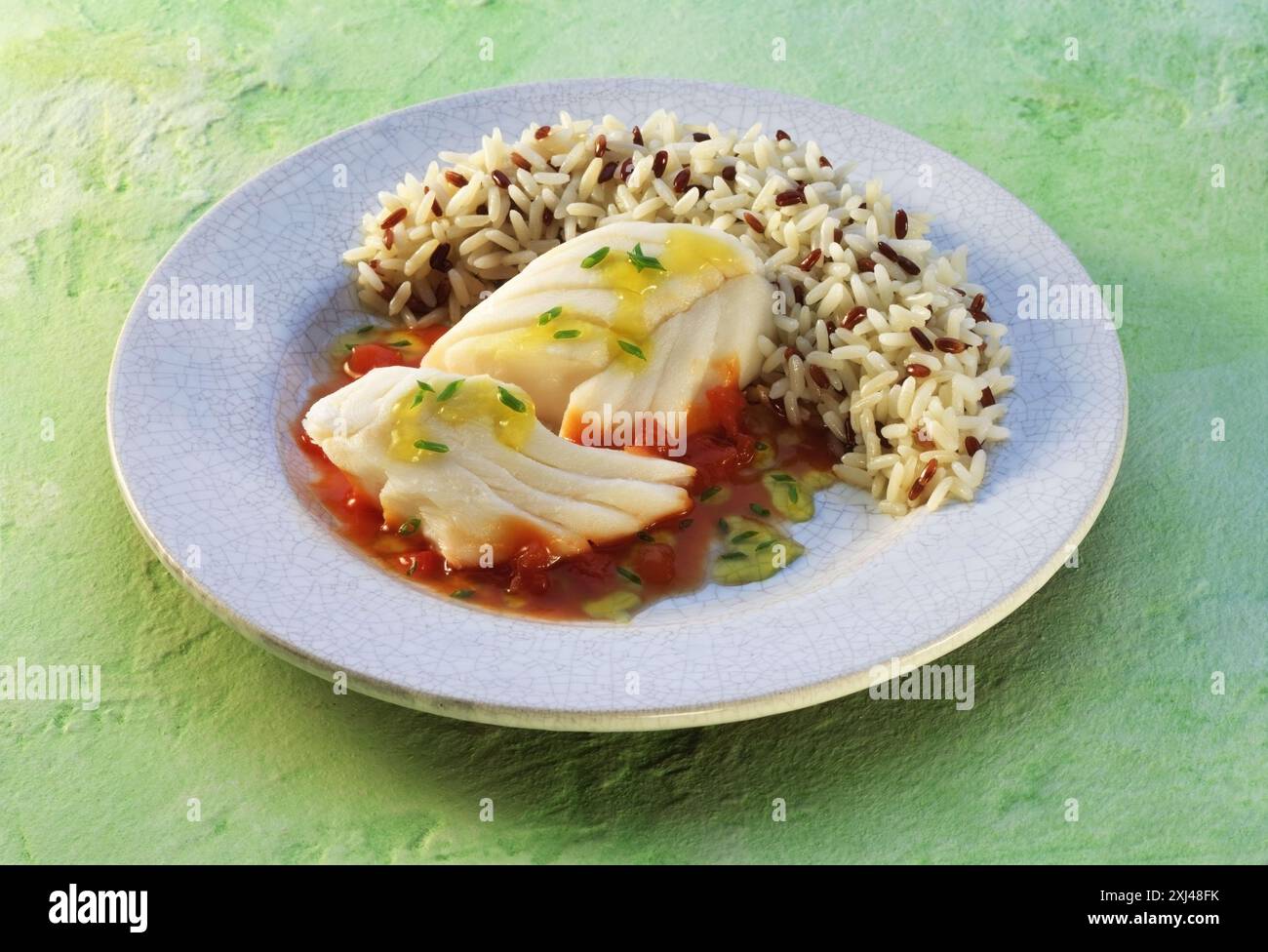 Cod with tomato sauce and rice Stock Photo - Alamy